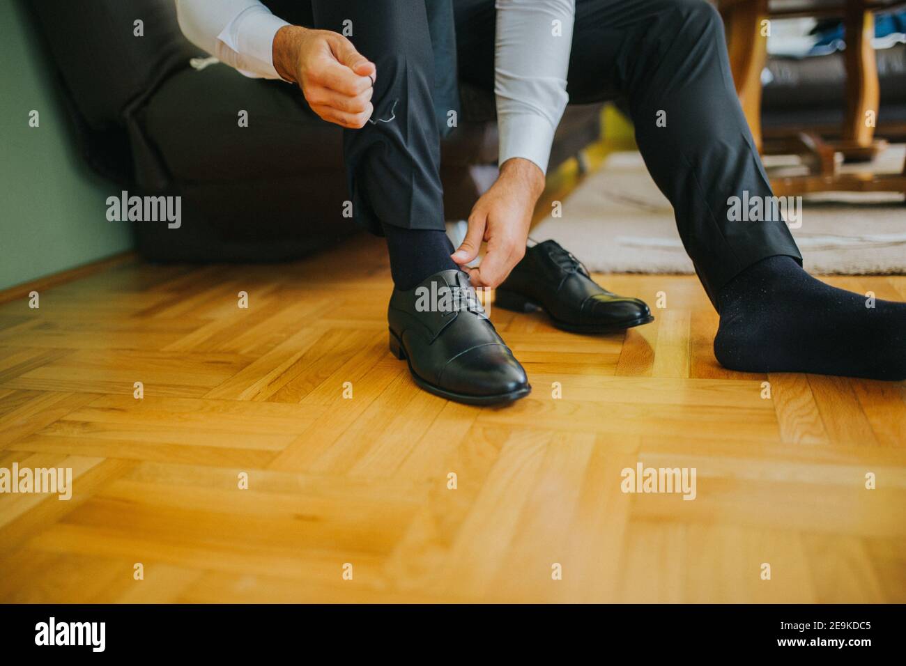 Groom putting his shoes and preparing for the wedding ceremony Stock ...