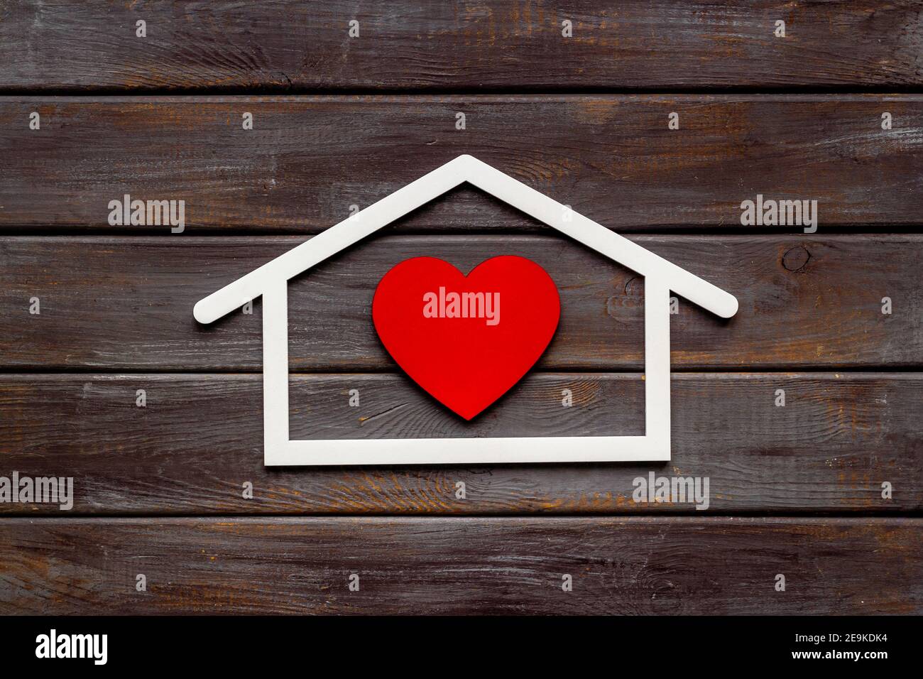 House shape with heart. Love family concept Stock Photo - Alamy