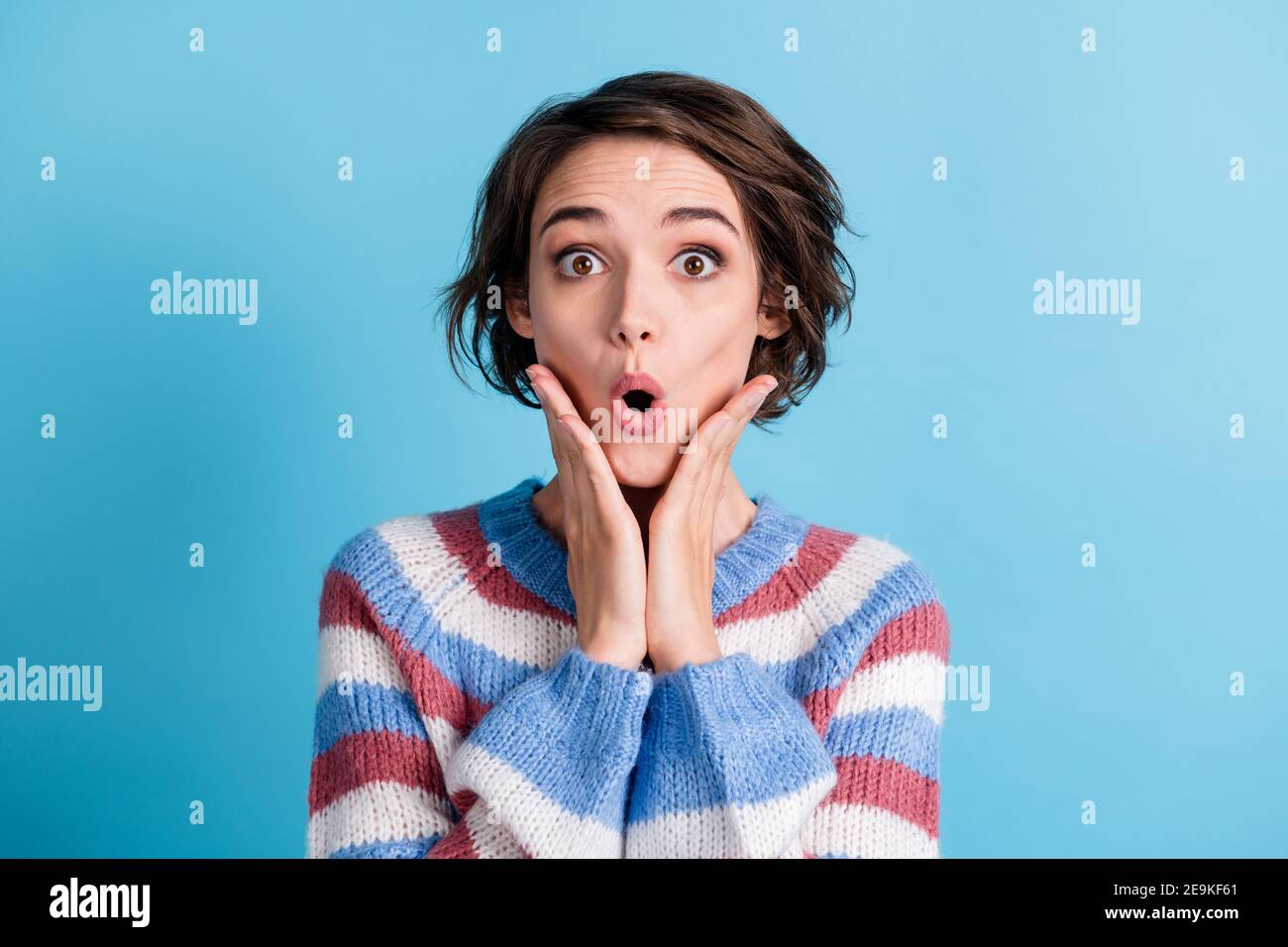 Photo of young pretty girl hands cheekbones staring look camera wear ...