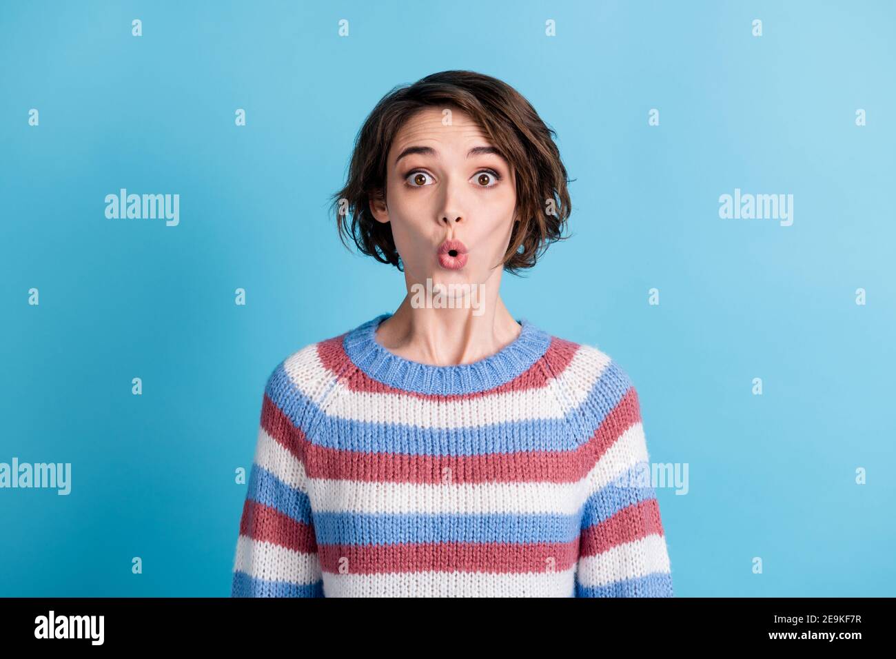 Photo of young charming girl shocked look excited wear colorful striped ...