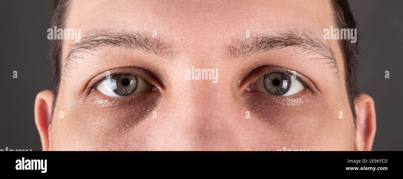 male eyes close up look panorama Stock Photo - Alamy