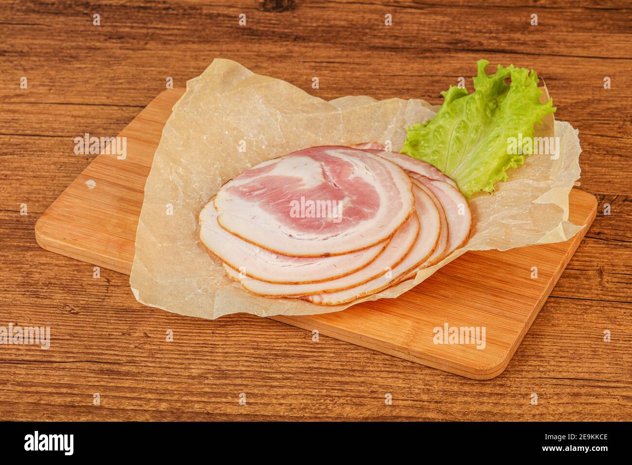Sliced Italian Pancetta sausage over board Stock Photo - Alamy
