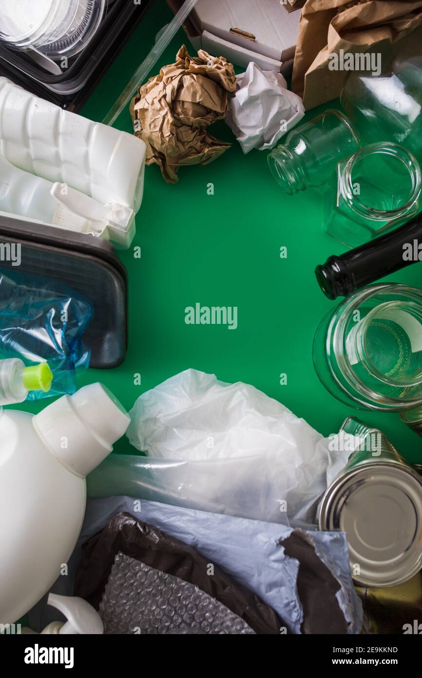 Recycling garbage on the green background like a border Stock Photo - Alamy