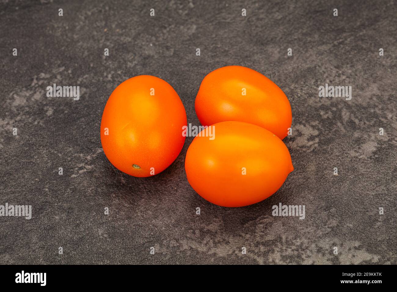 Tasty vegetables - Yellow tomato heap over background Stock Photo - Alamy