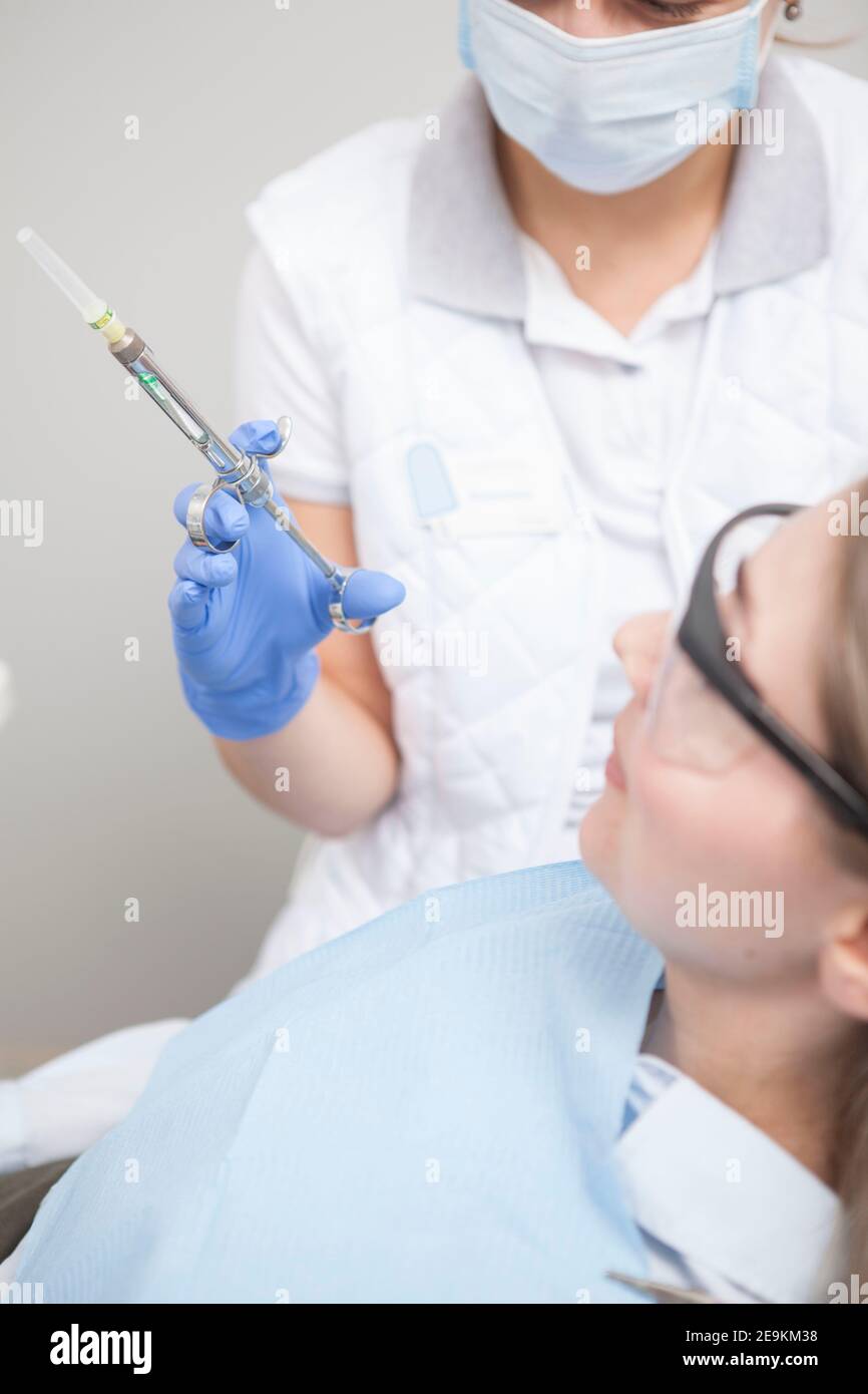 Female Dentist With Syringe Close Up Shot Of Dentist Administering