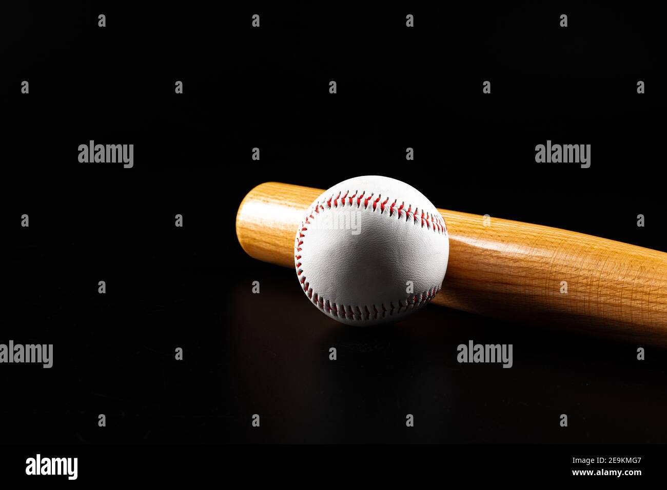 Baseball game equipment on dark black background Stock Photo - Alamy