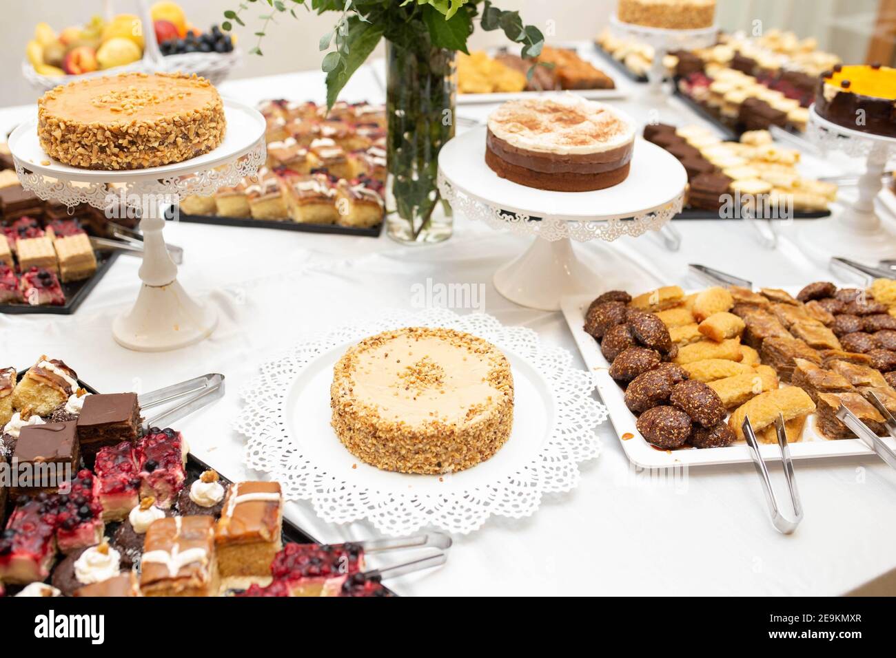 Dessert table with various pastries, coffee and nut cakes Stock Photo ...