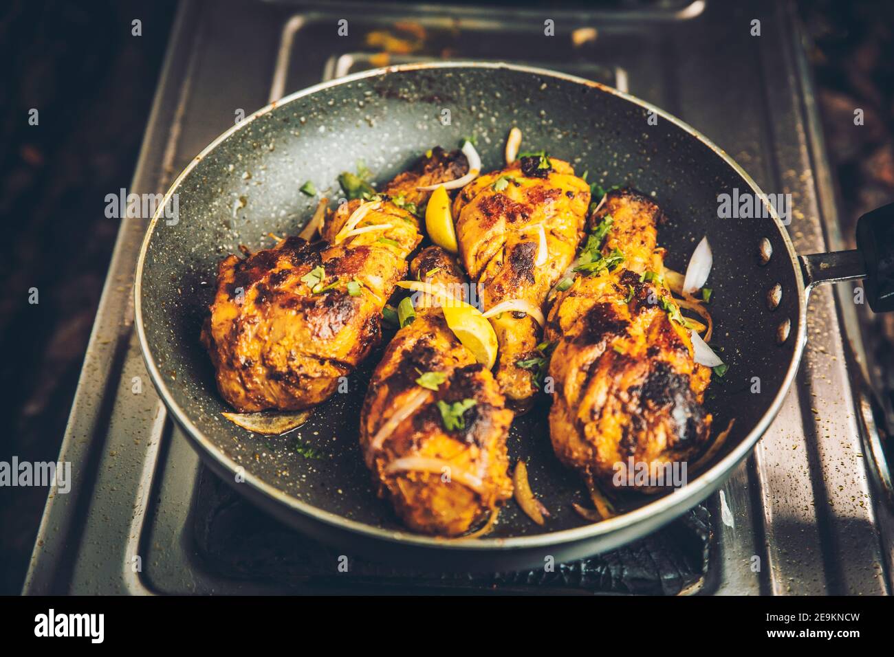 Homemade Pan Fried Rosted Chicken Leg Piece on a cooking pan Stock ...