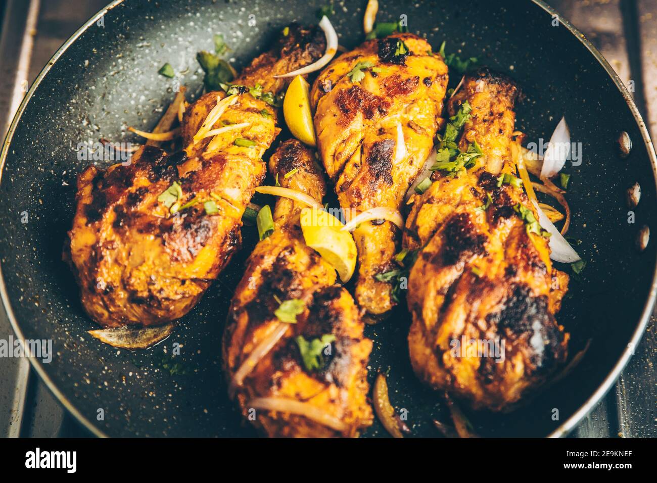 Homemade Pan Fried Rosted Chicken Leg Piece on a cooking pan Stock ...