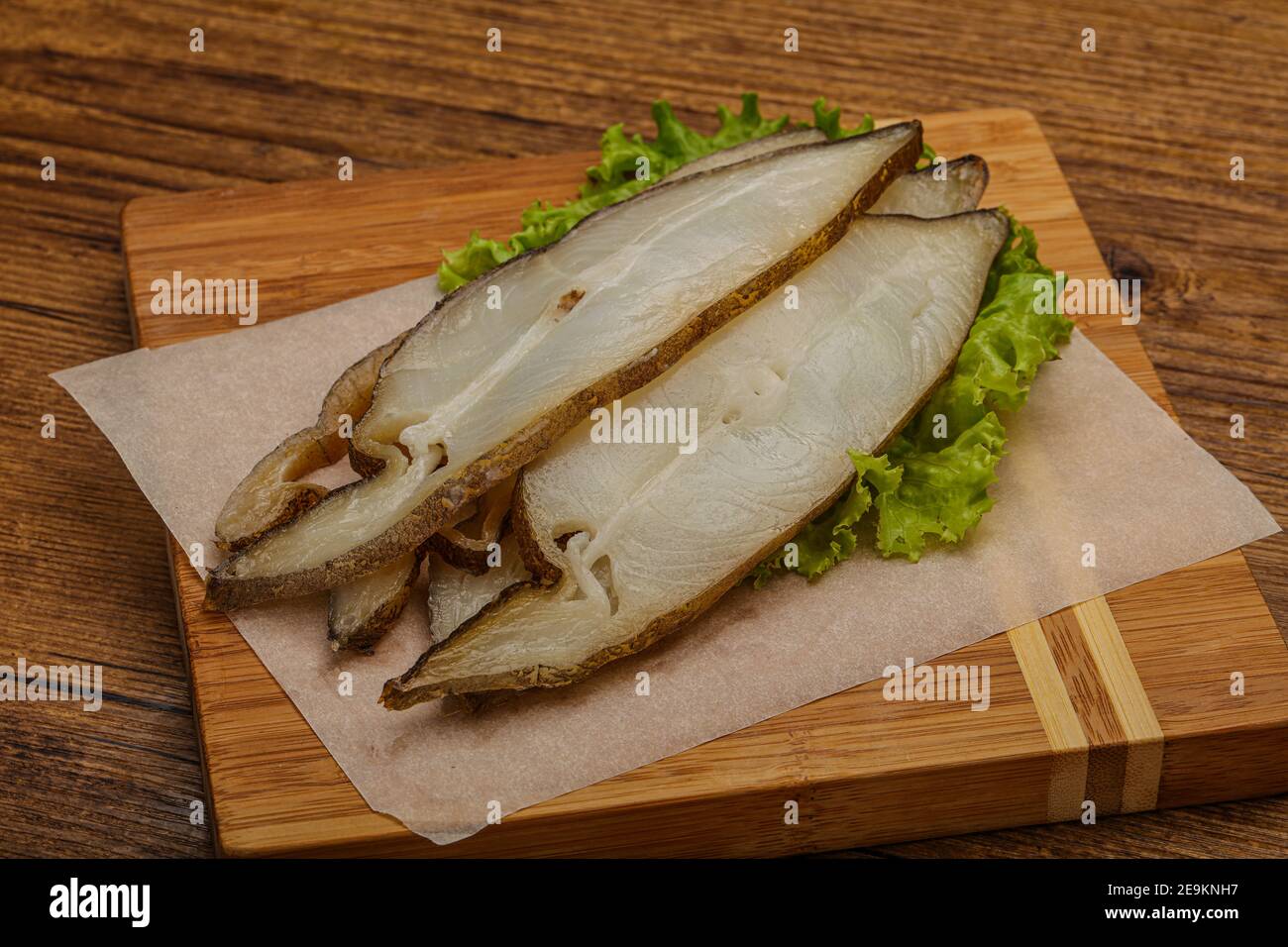 Delicous smoked halibut fish slices snack Stock Photo - Alamy