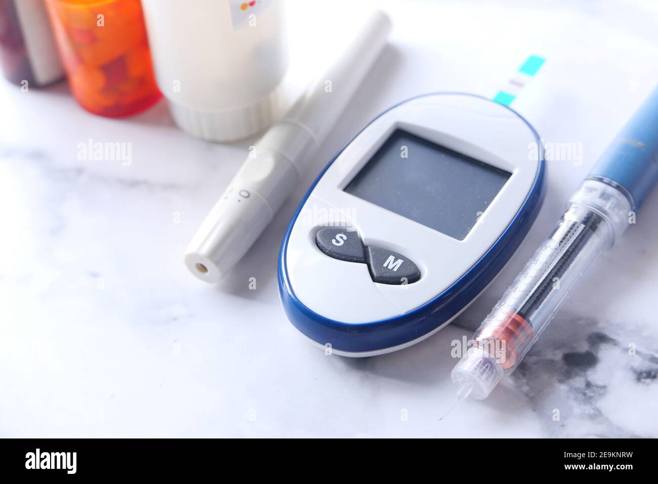 Close up of diabetic measurement tools, insulin and pills on white ...