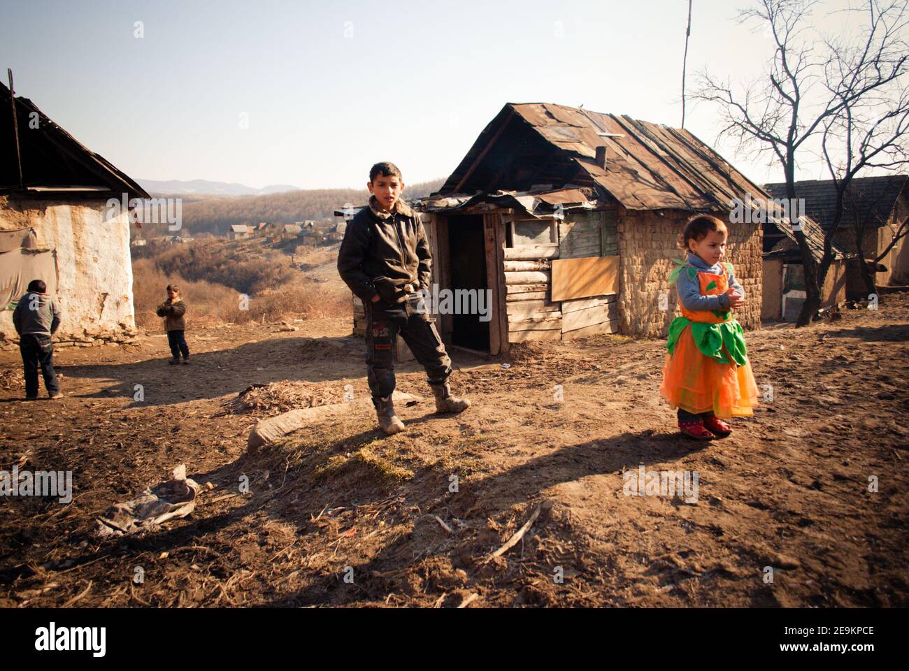 SEREDNIE, UKRAINE - MARCH 09, 2011: Older Romani children help parents ...