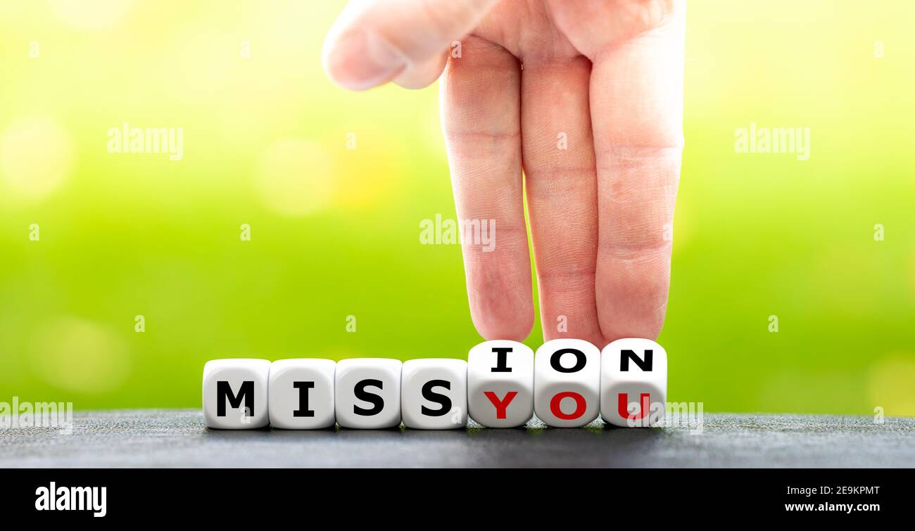 Dice forms the expressions "miss you" and "mission Stock Photo - Alamy