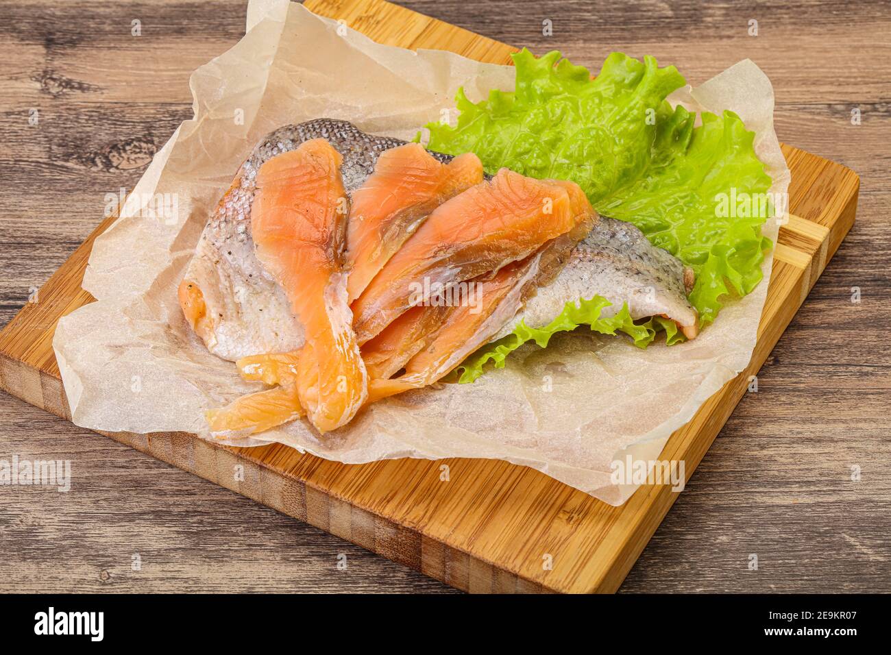 Sliced natural wild trout fillet over board Stock Photo - Alamy