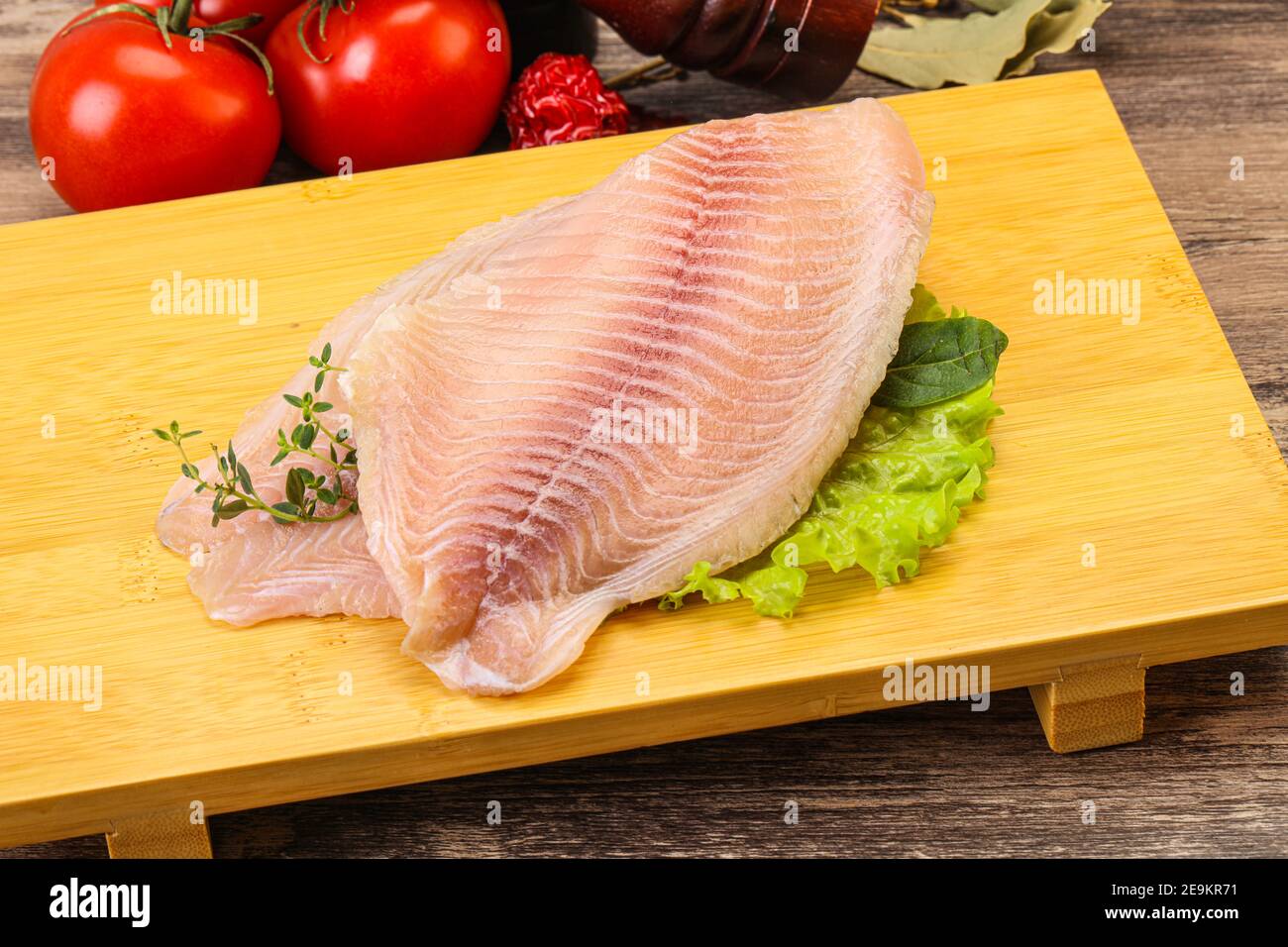 Raw tilapia fish fillet for cooking Stock Photo - Alamy