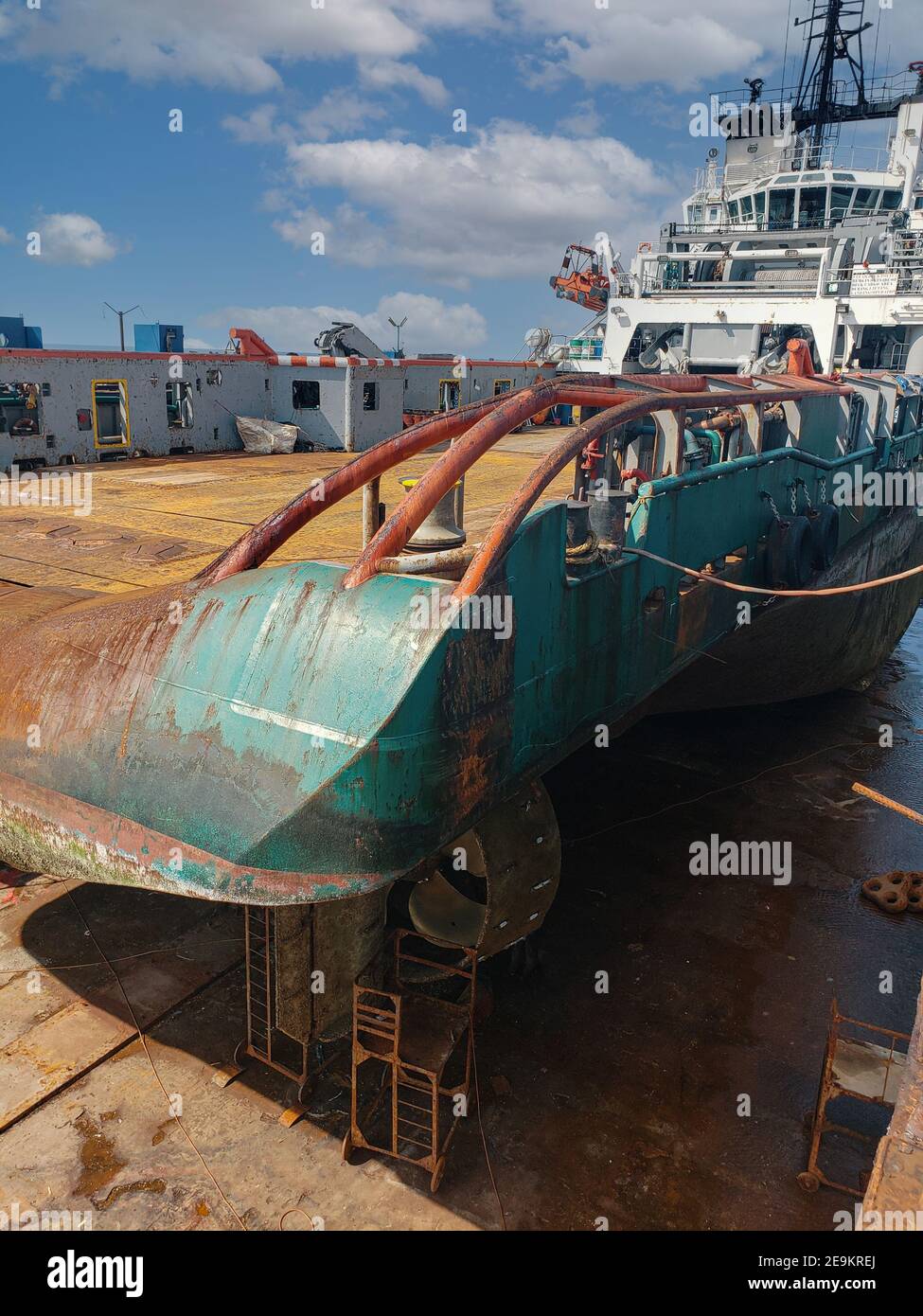 Industry view - Ocean Vessel in the dry dock in shipyard. Old rusty ...