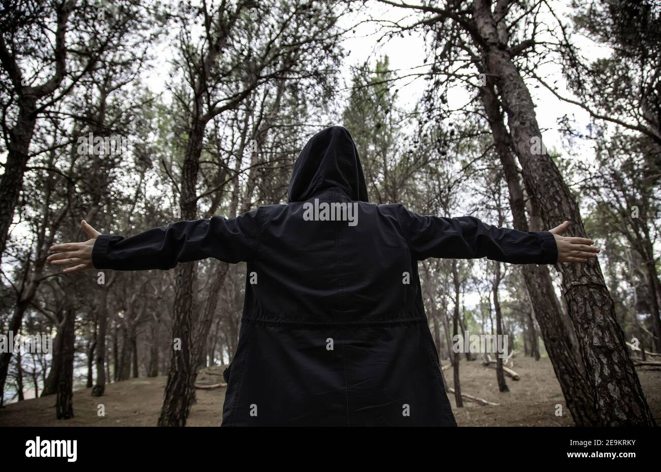 Hooded person in forest with problems, youth and crisis Stock Photo - Alamy