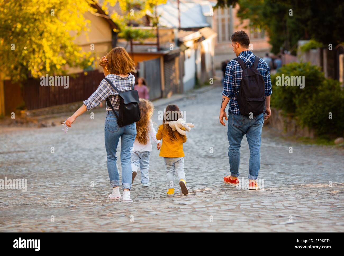 Parents walking down the street with kids hi-res stock photography and ...
