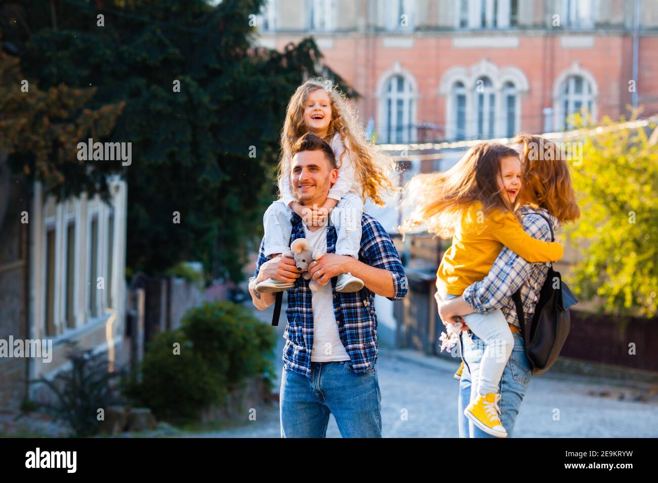 the unforgettable journey through the old town for a young family Stock ...