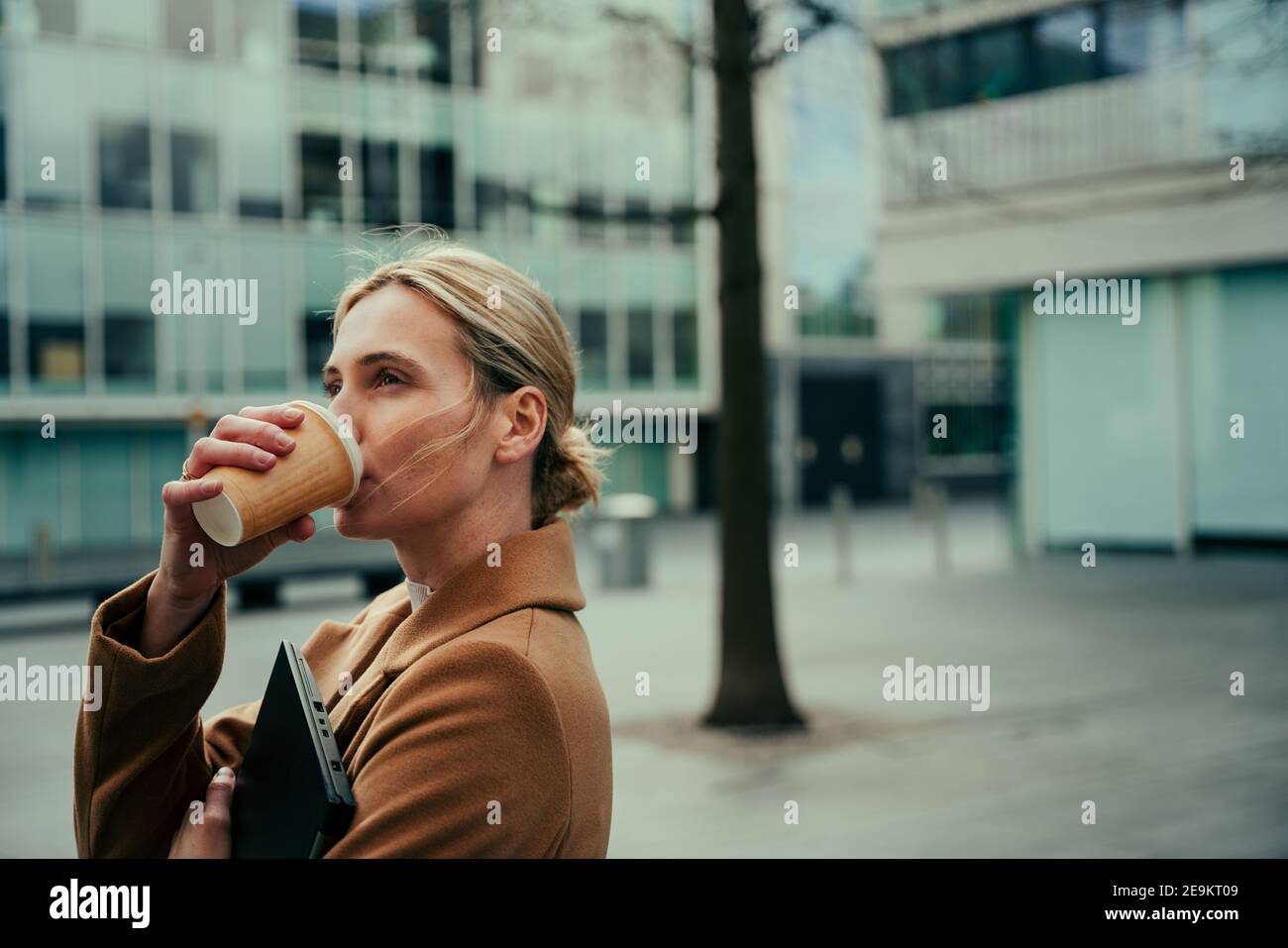 Caucasian business woman drinking hot coffee walking to job interview ...
