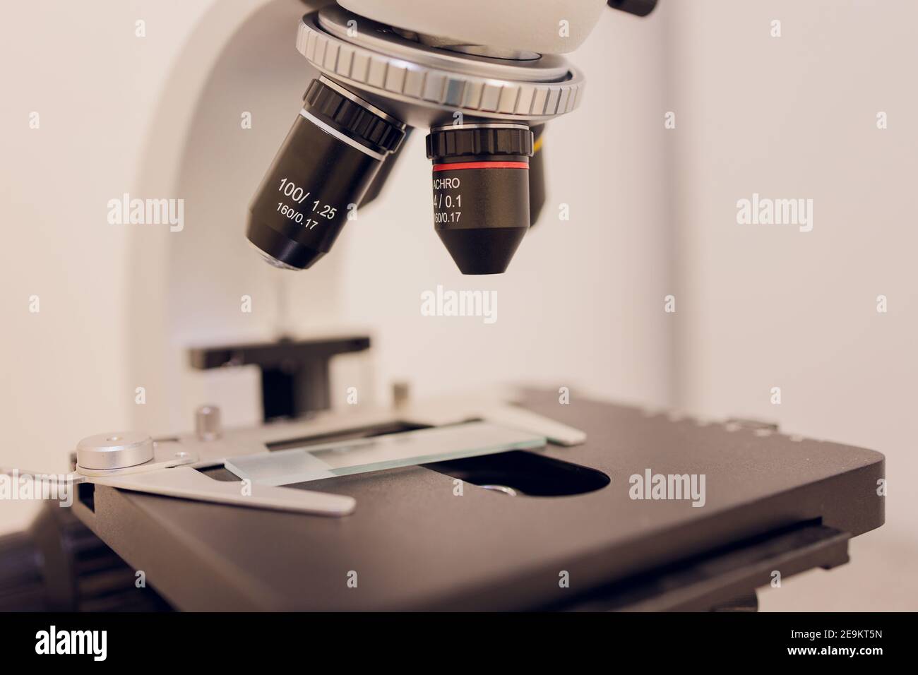 Scientist hands with microscope close-up shot in the laboratory Stock ...