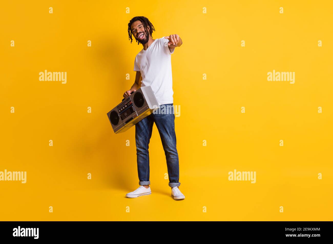 Full length photo of black guy direct finger you hold retro radio wear ...