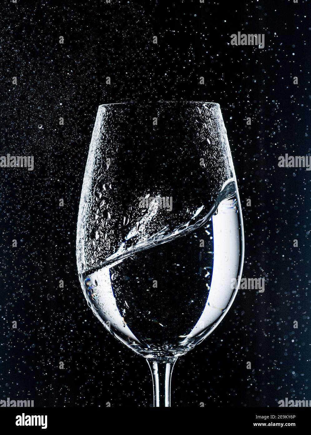 Clear water in a glass, delicious spring transparent with a splash in ...