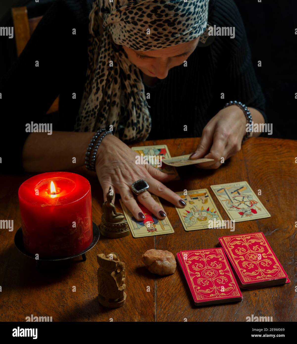 A fortune teller reads the tarot cards to predict the future Stock ...