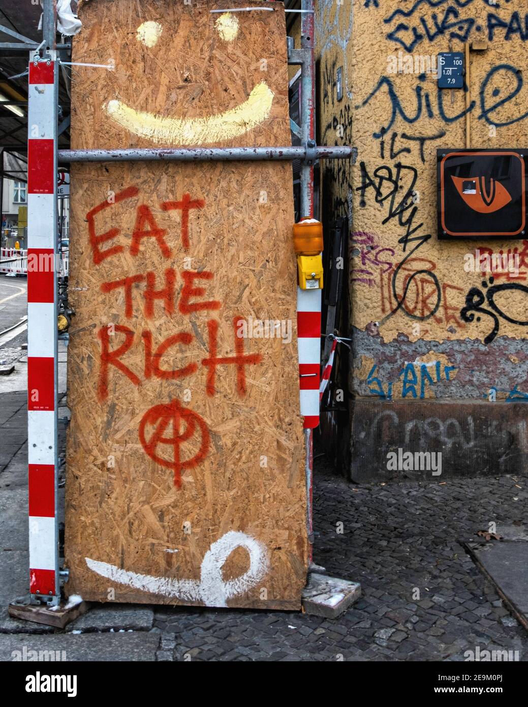 Eat the Rich graffiti on Builder's scaffolding in Torstrasse, Mitte ...