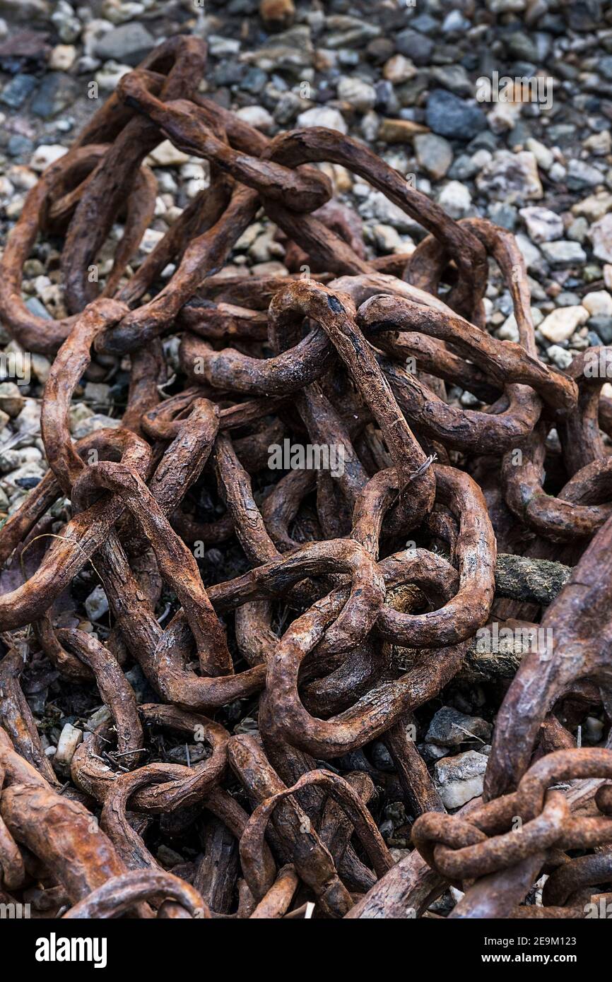 Rusty chain lying on the ground Stock Photo - Alamy