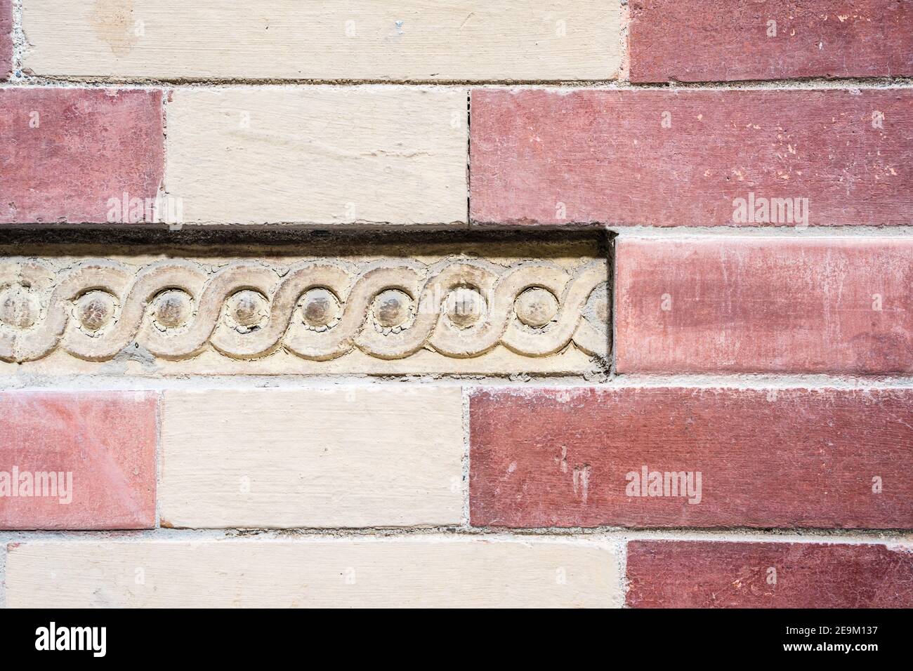 Closeup of red and white wall with decorative design Stock Photo - Alamy