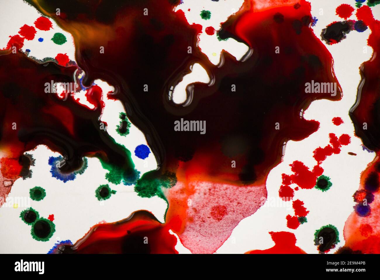 Top view of colorful paint drops on a canvas for wallpapers Stock Photo ...