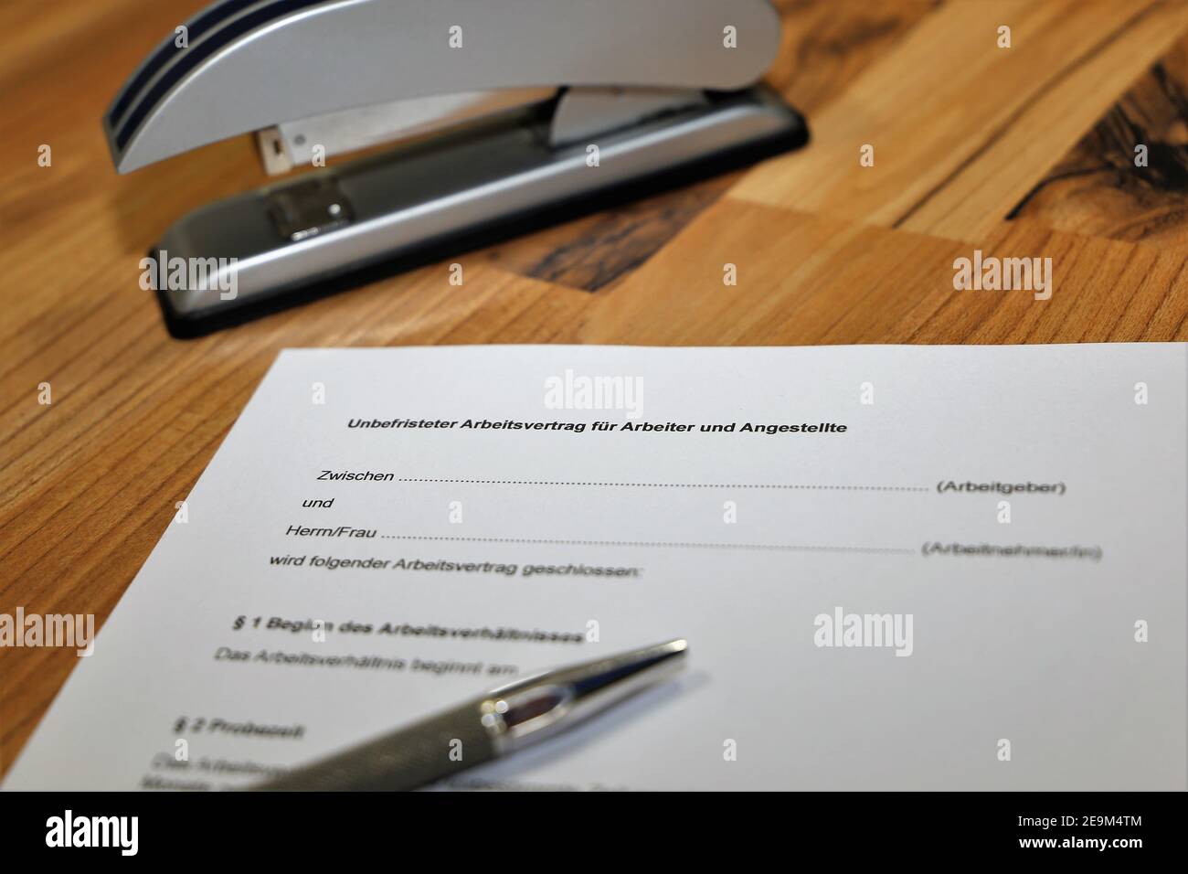 Symbol image: Open-ended employment contract lying on a desk Stock ...