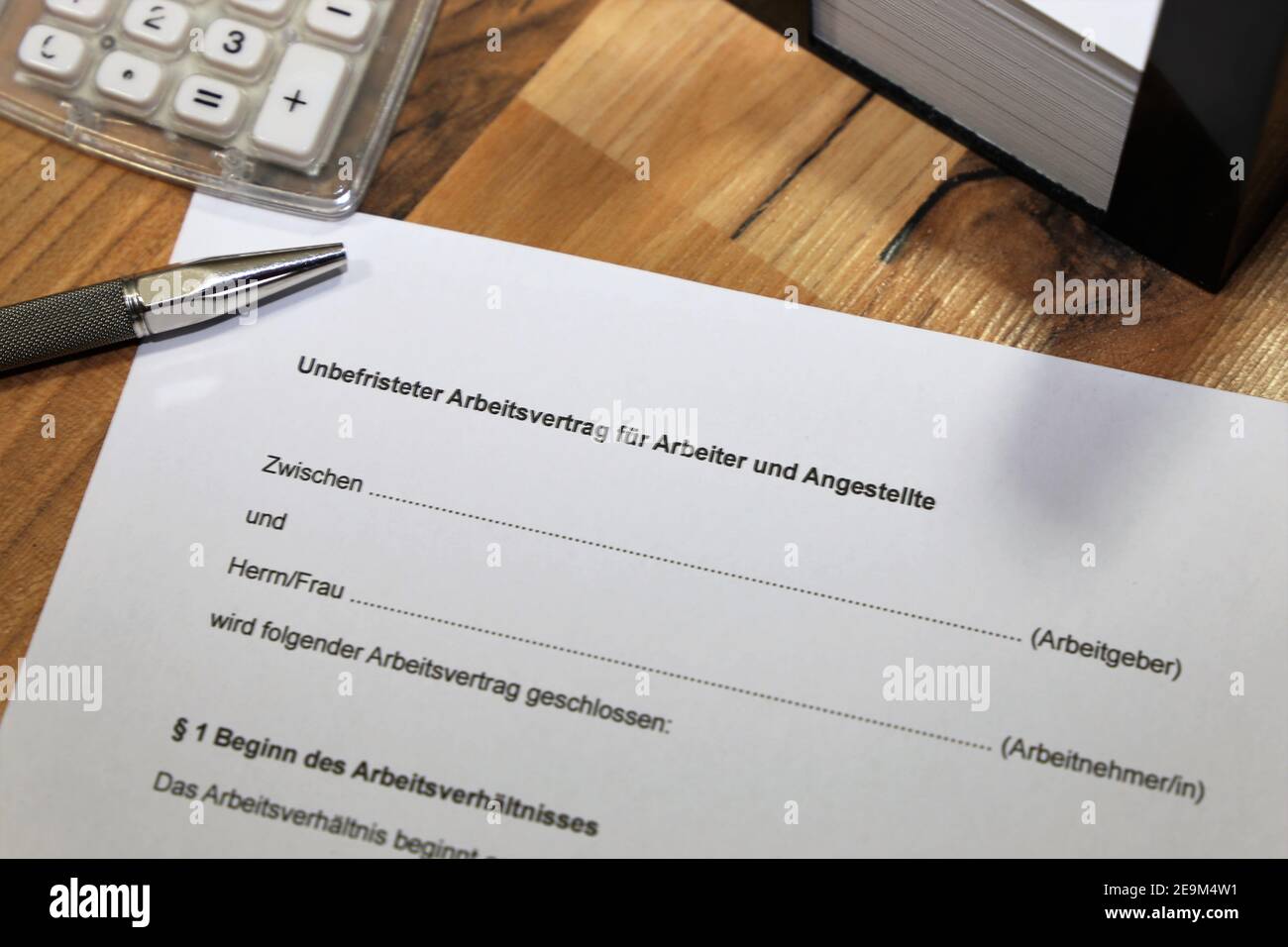 Symbol image: Open-ended employment contract lying on a desk Stock ...