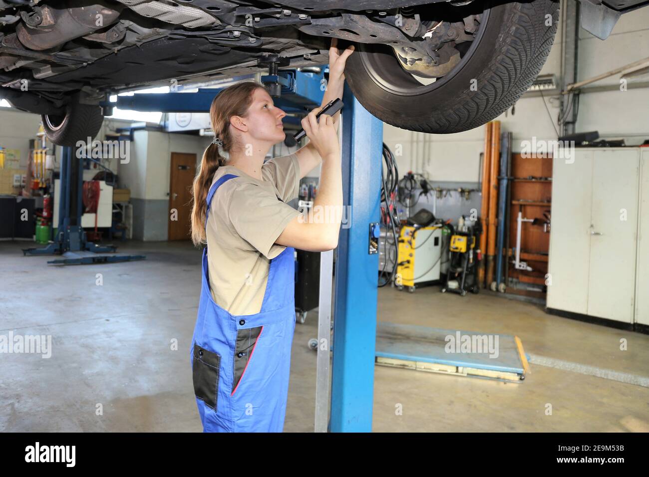 Symbol image: Woman in male-dominated profession: Car mechanic (model ...