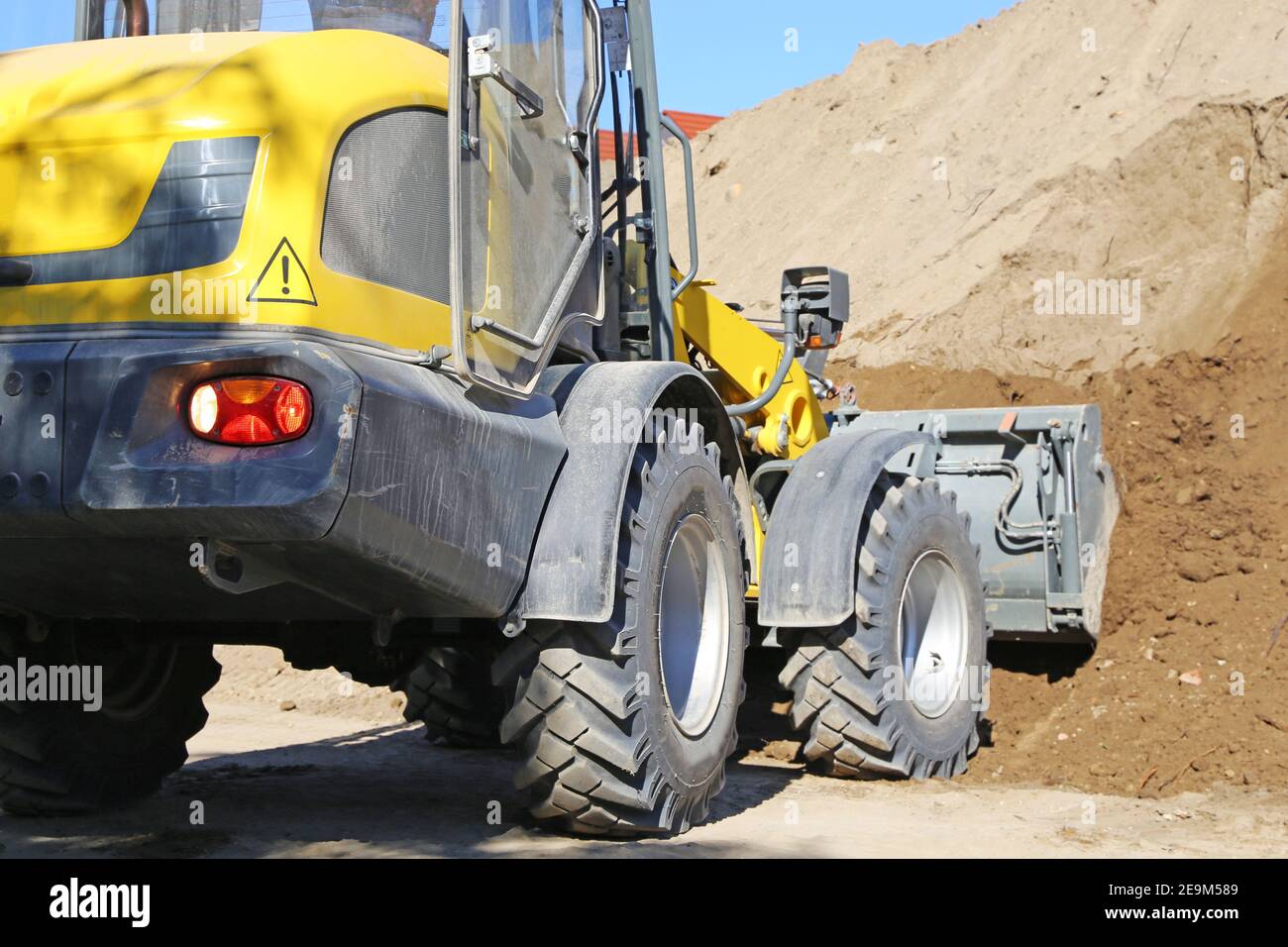 Excavation work with excavator on a building site Stock Photo - Alamy