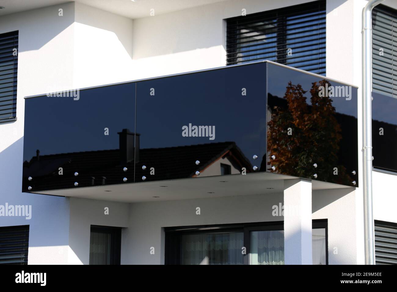 Black balcony railing made of glass and stainless steel Stock Photo - Alamy