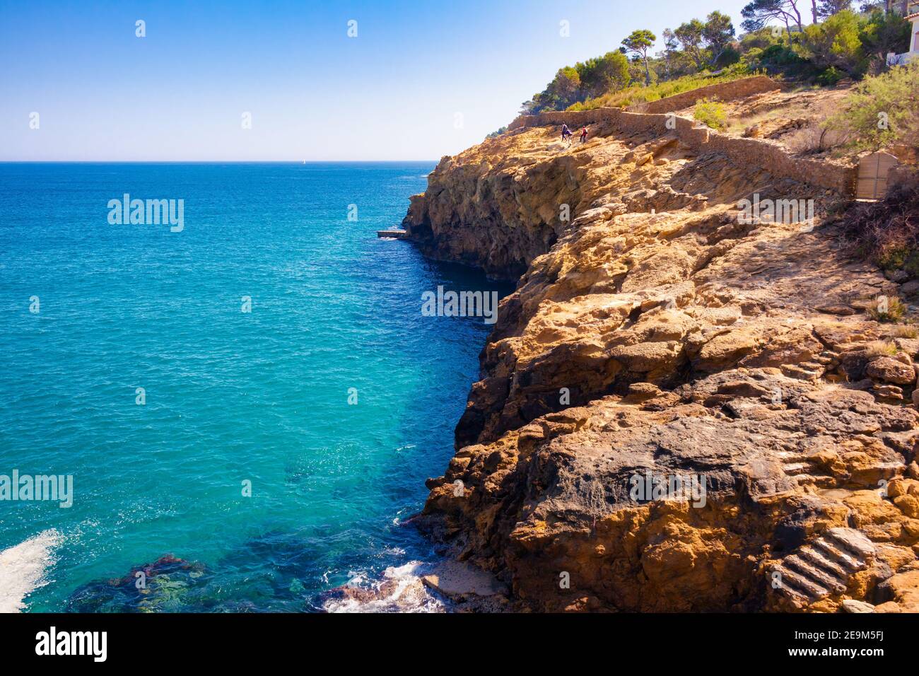 View of the coastal path of Sa Riera beach to Cala S'Antiga and Punta ...
