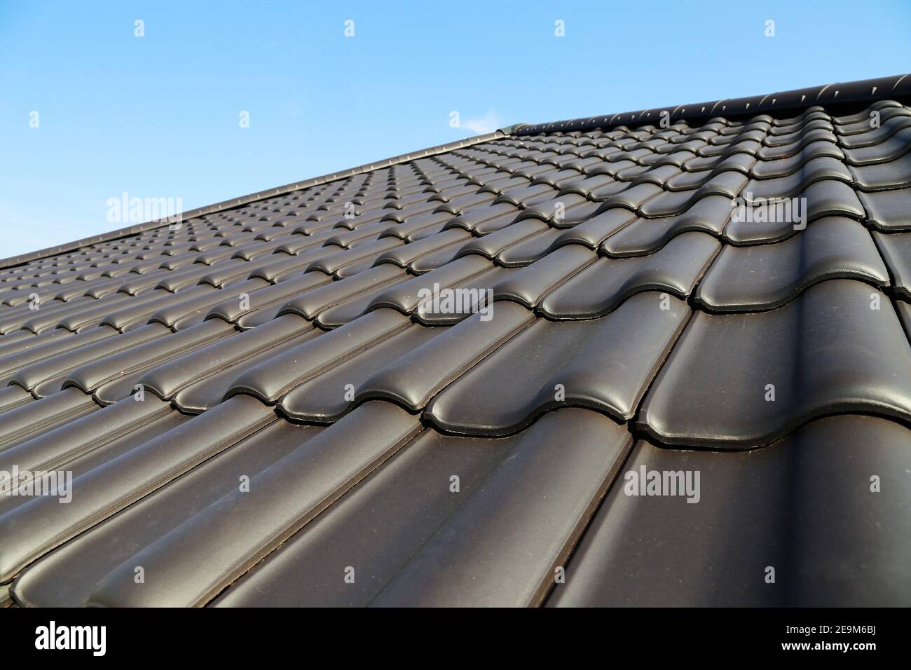 New tile roof on a residential house Stock Photo - Alamy