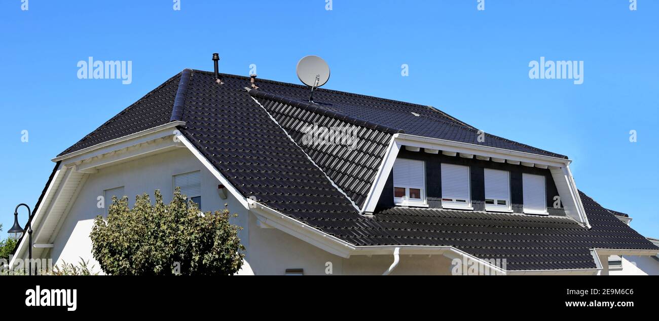 New tile roof on a residential house Stock Photo - Alamy