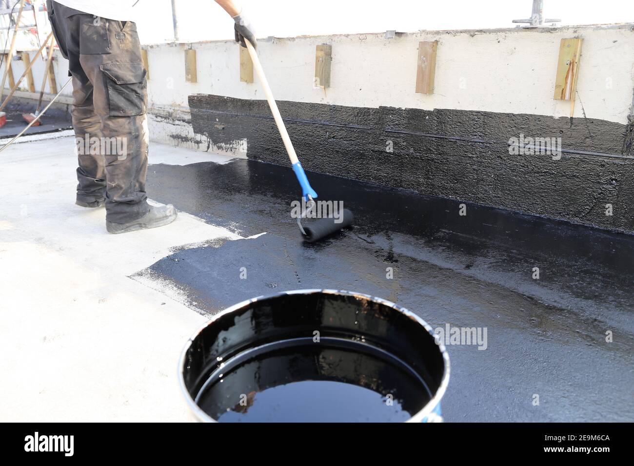 Bitumen primer for flat roof waterproofing Stock Photo - Alamy
