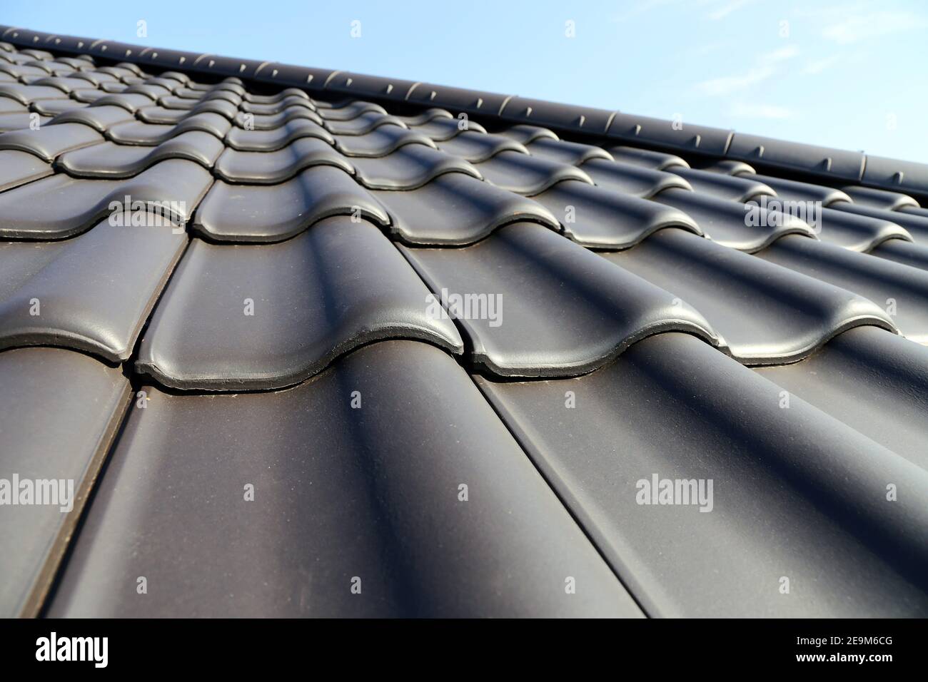 New tile roof on a residential house Stock Photo - Alamy