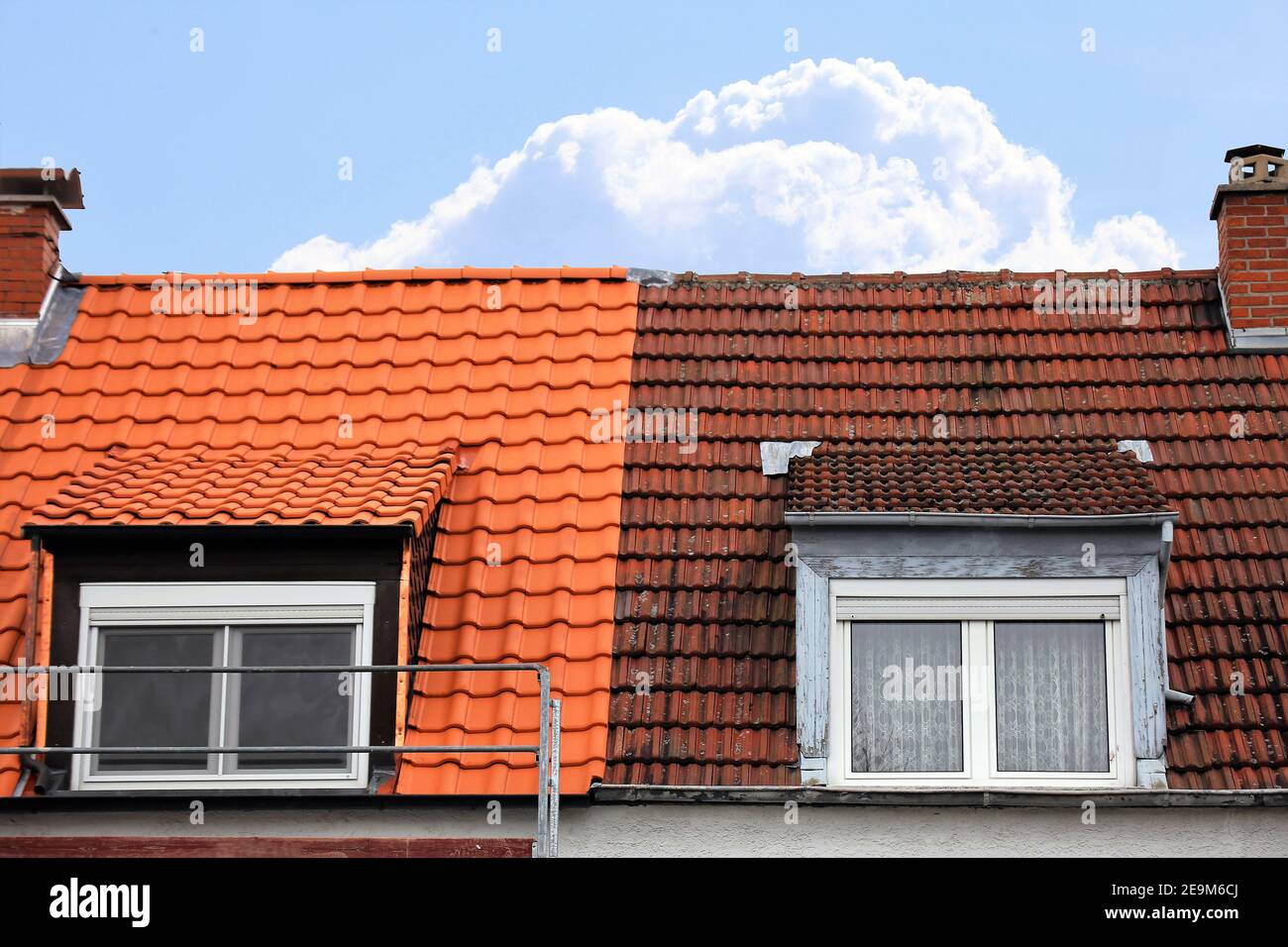 Semi-detached house with old roof and with renovated roof Stock Photo ...