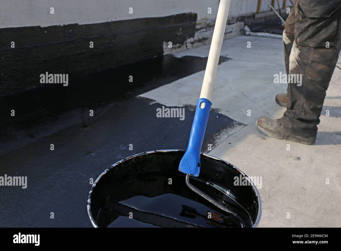 Bitumen primer for flat roof waterproofing Stock Photo - Alamy