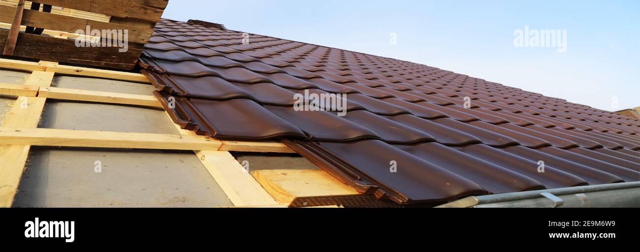 New roof covering in progress (Panoramic image Stock Photo - Alamy
