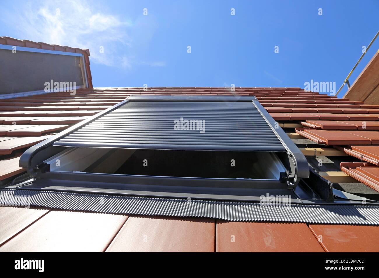 Roof window with roller shutter Stock Photo - Alamy