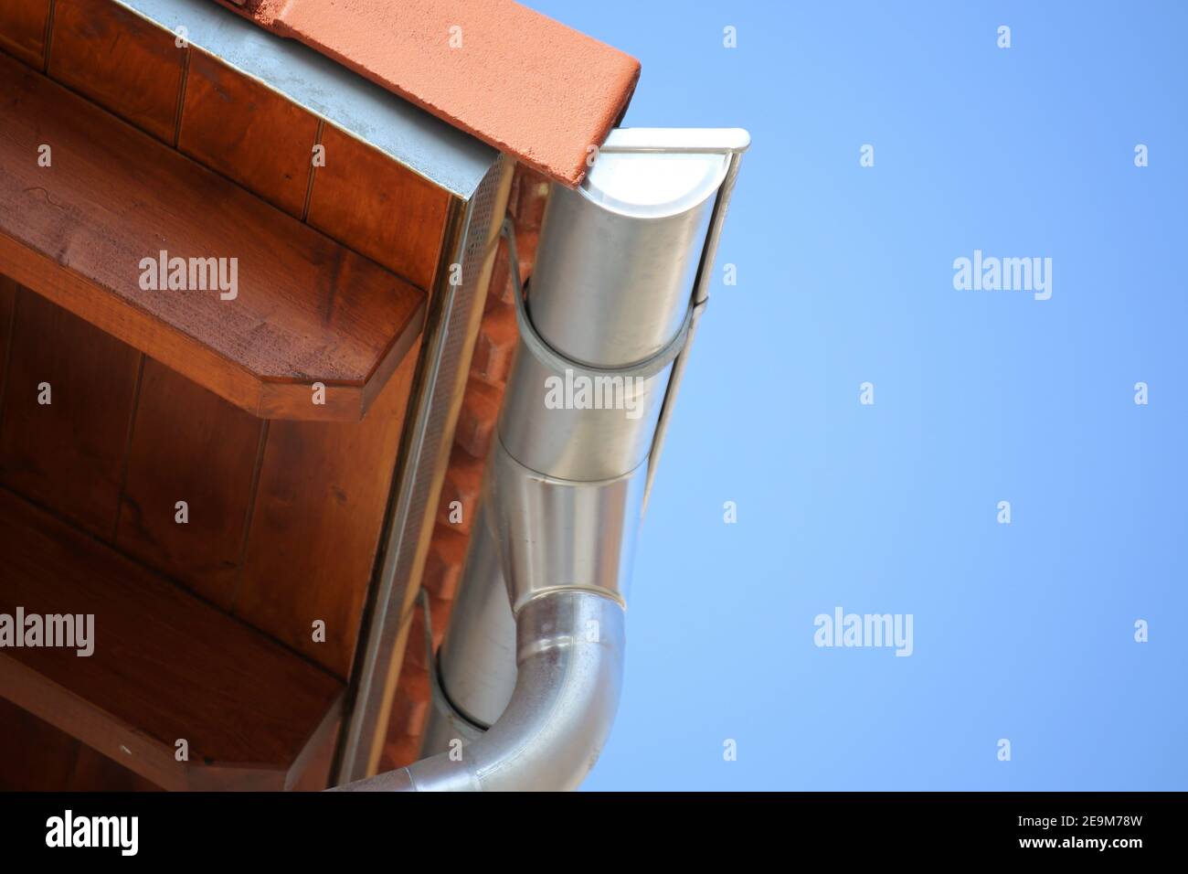 Roof gutter on a new tiled roof Stock Photo - Alamy