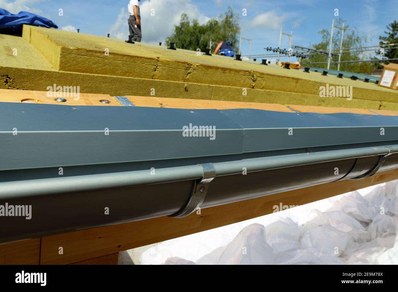 Roof gutter on a new tiled roof Stock Photo - Alamy