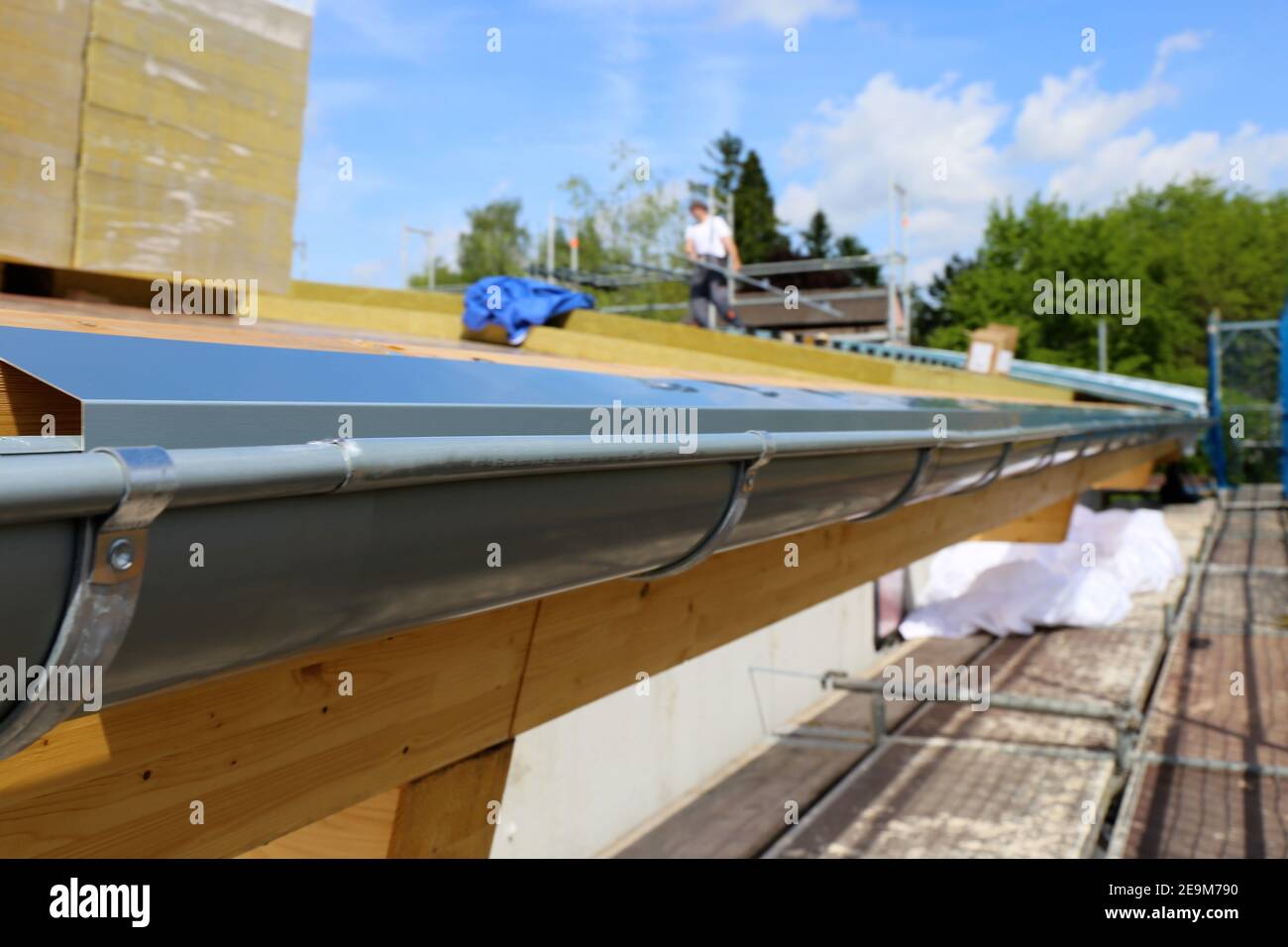 Roof gutter on a new tiled roof Stock Photo - Alamy