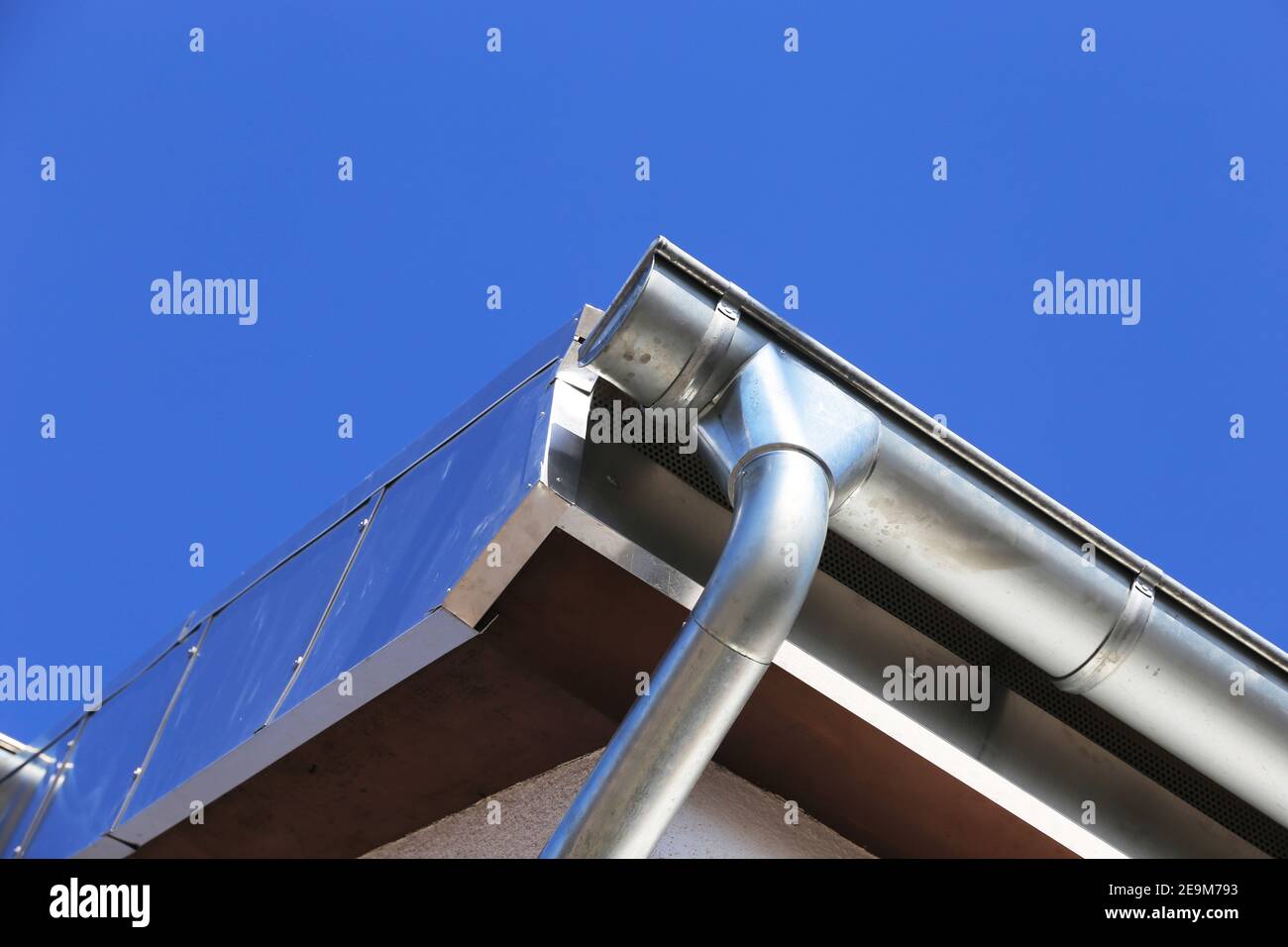 Roof gutter on a new tiled roof Stock Photo - Alamy